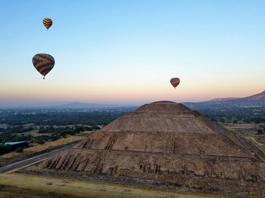 Pyramid of the Sun at Teotihuacan with balloons overhead at sunset