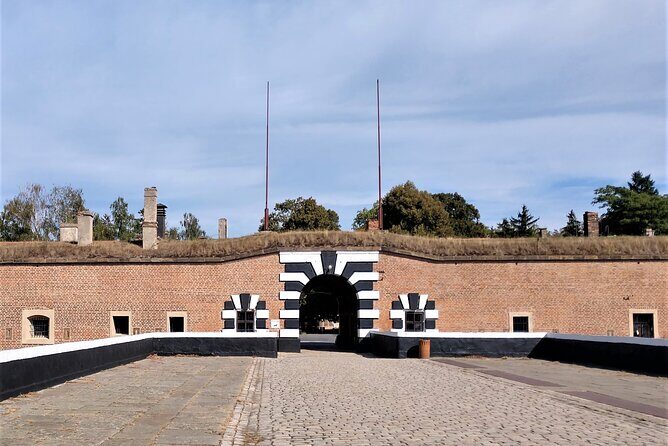 Terezin Tour Including Admission Ticket and Transfer & Audio - The Experience: Guides, Transport, and Atmosphere