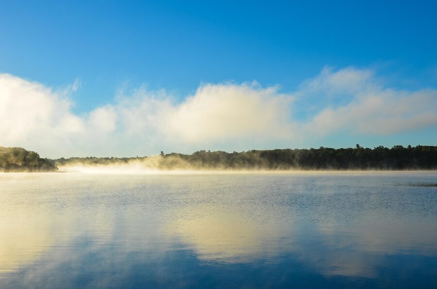 Thousand Islands reflection on still water at dusk