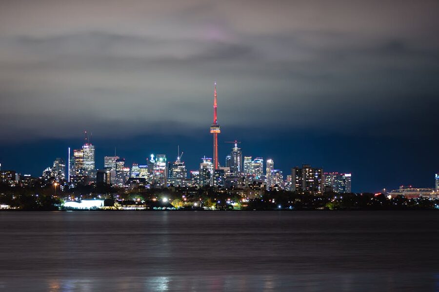 Toronto skyline and CN Tower glowing at night