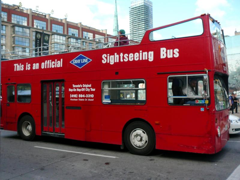 Toronto City Sightseeing double-decker bus at a stop