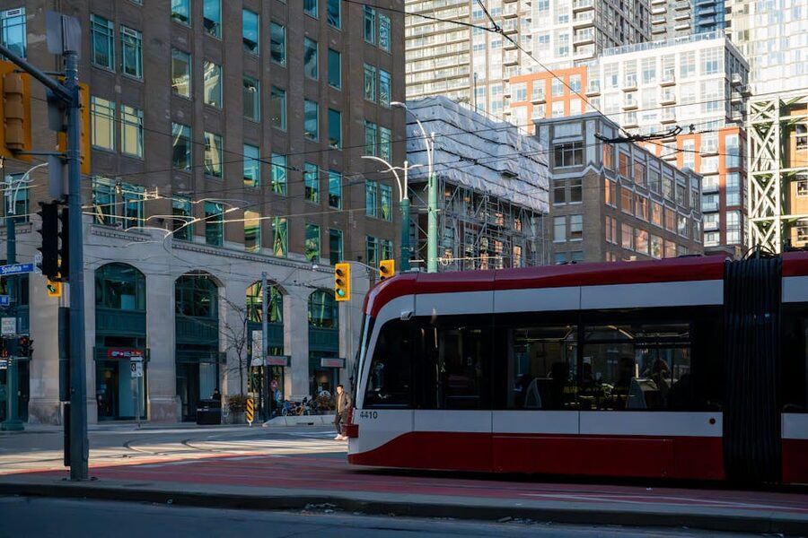 Red Toronto streetcar on Queen Street downtown