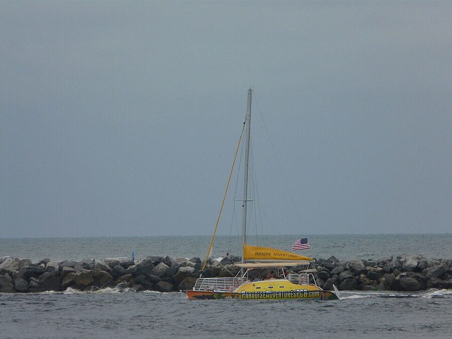 Touring sailboat passing through the St Andrews inlet near Panama City Beach