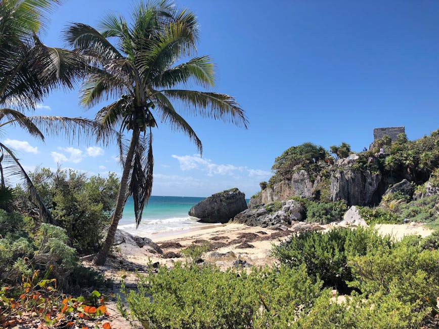 Tulum El Castillo pyramid on cliff above beach