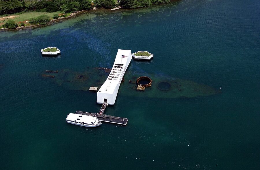 Aerial view of the USS Arizona Memorial at Pearl Harbor with the sunken ship visible below