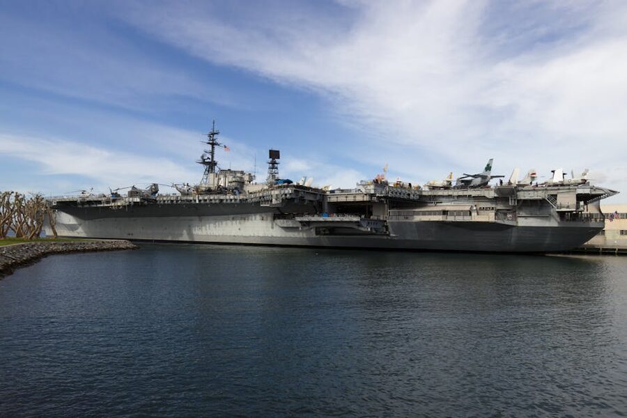 USS Midway aircraft carrier docked in San Diego Harbor with moody clouds