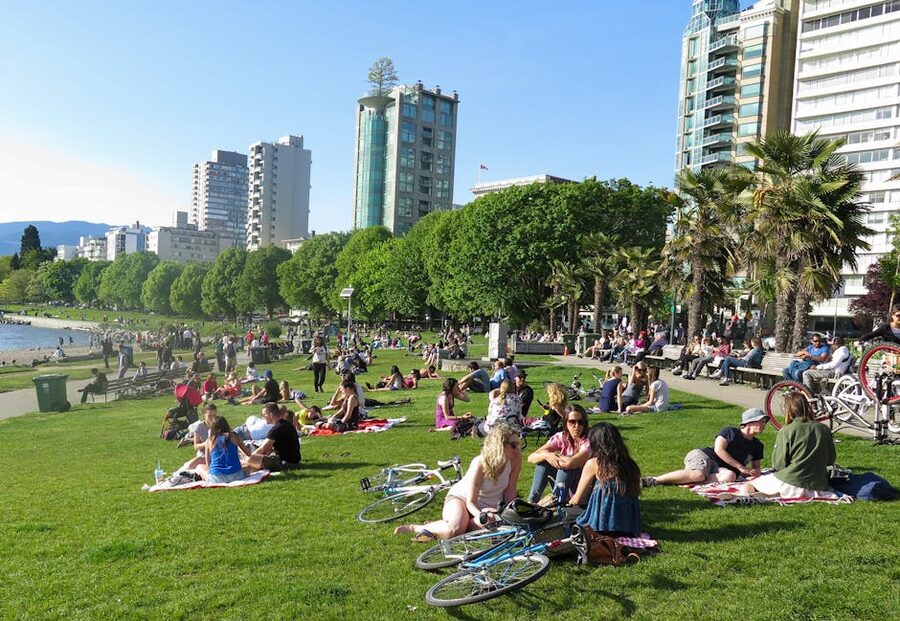 People at English Bay Park on a sunny day in Vancouver