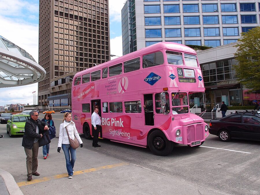 Pink hop-on hop-off bus at Canada Place Vancouver