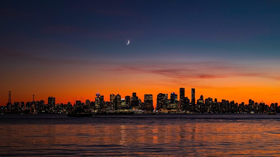 Vancouver twilight panorama with moon over the city