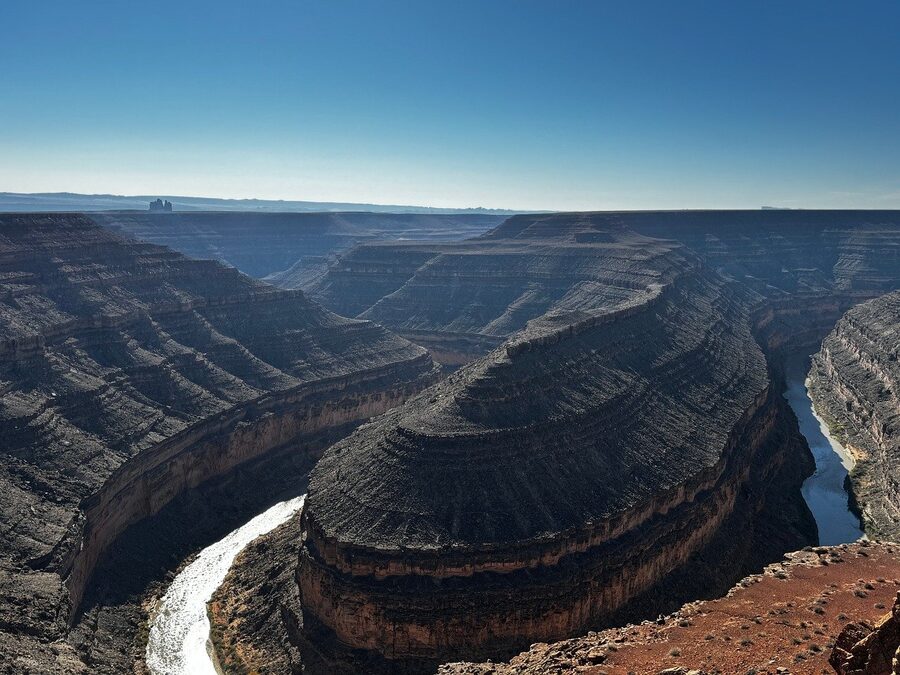 Panoramic view of desert canyon landscape at golden hour