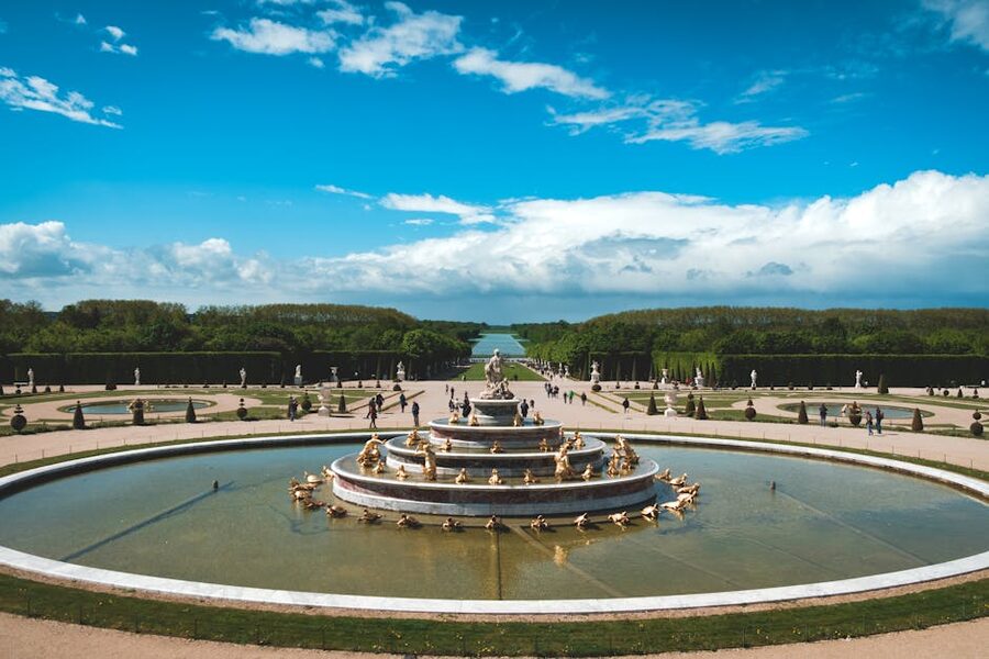 Versailles garden fountain under blue sky