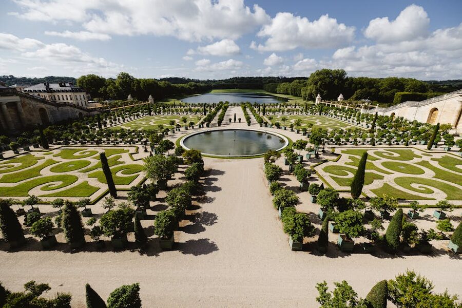 Aerial view of geometric gardens of Versailles in summer