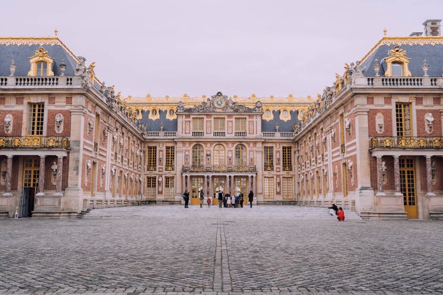 Marble Courtyard at the Palace of Versailles with visitors