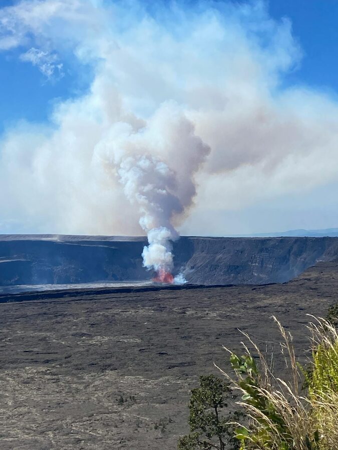 Volcanic eruption with smoke and lava in Hawaii landscape