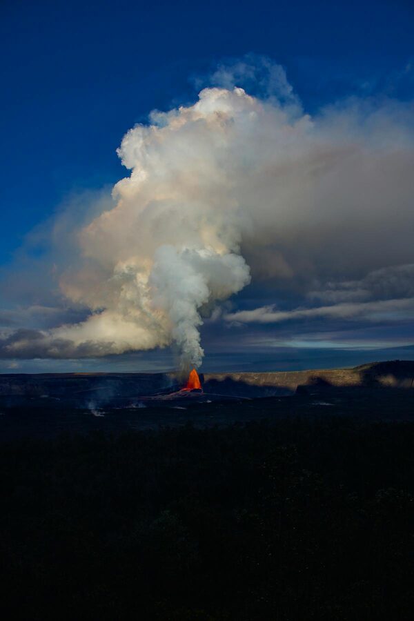 Volcanic eruption with smoke plume at Hawaii Volcanoes National Park