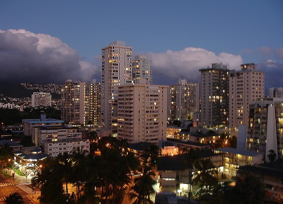 Waikiki Beach with Diamond Head and surfer in Honolulu Hawaii