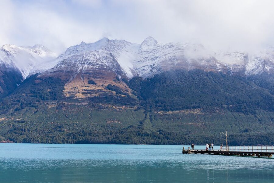 Dock on Lake Wakatipu with snow-capped mountains in Queenstown