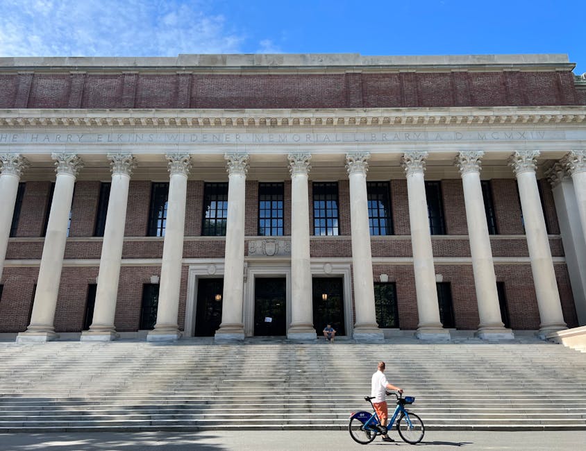 Widener Library Harvard with cyclist passing in front