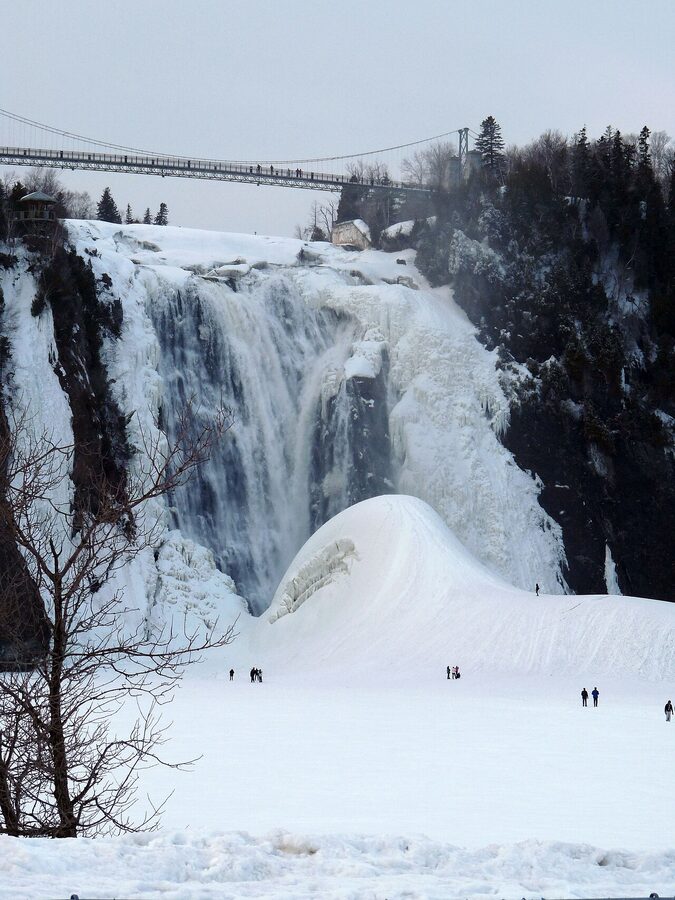 Pain de Sucre ice cone at the base of Montmorency Falls in winter