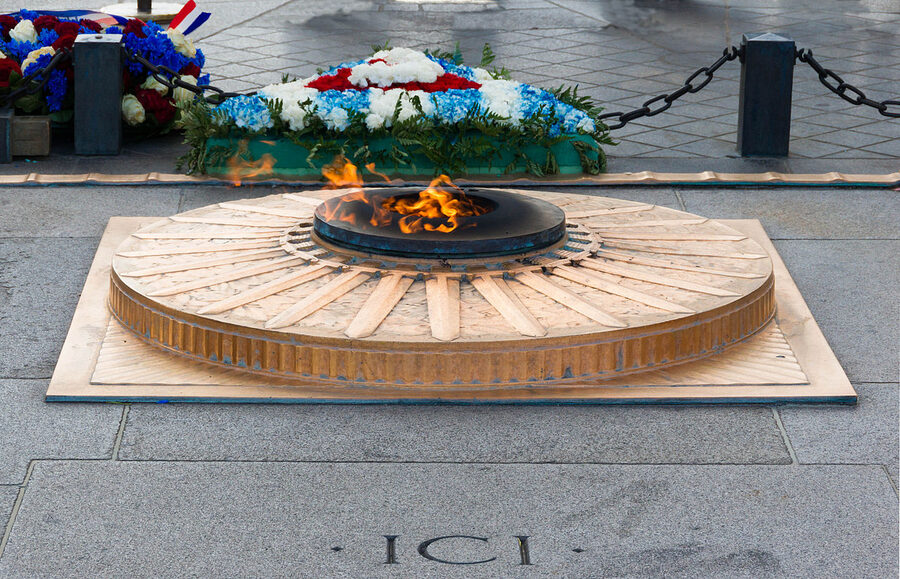 Eternal flame at the Tomb of the Unknown Soldier under the Arc de Triomphe