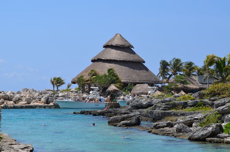 Xcaret Park beach with palapa hut and turquoise Caribbean water