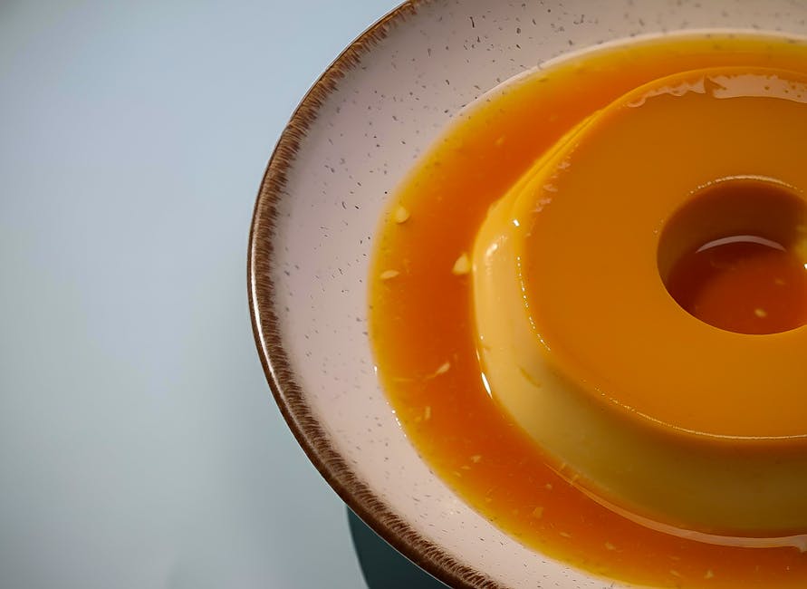 Creamy caramel flan dessert on a ceramic plate