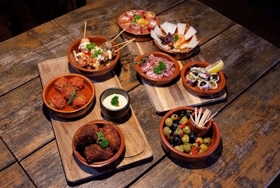 Traditional Spanish tapas assortment on a rustic wooden board