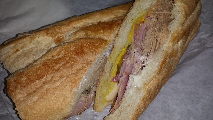 Tampa Cuban sandwich pressed and sliced on plate