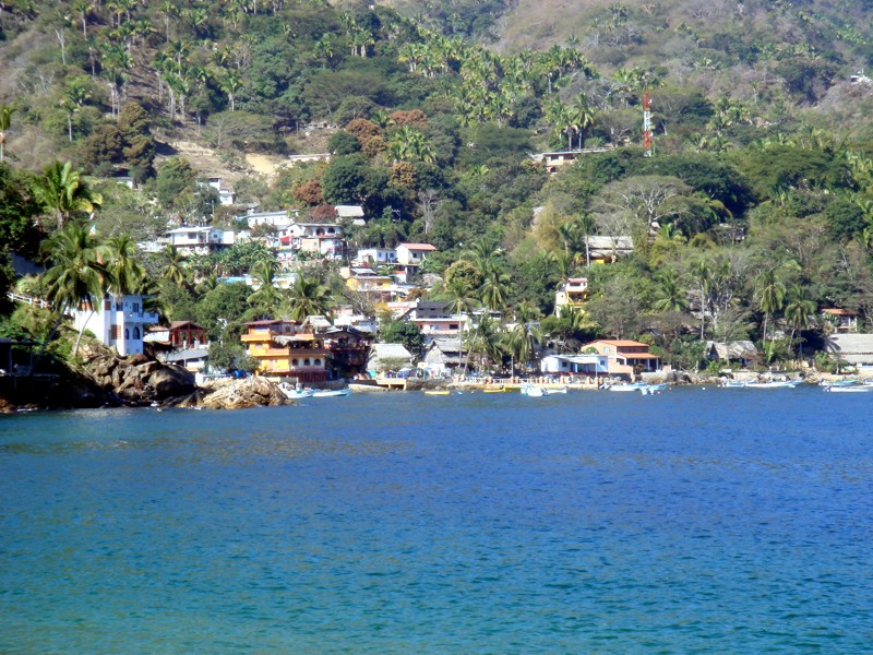 Yelapa village houses along the hillside seen from the bay