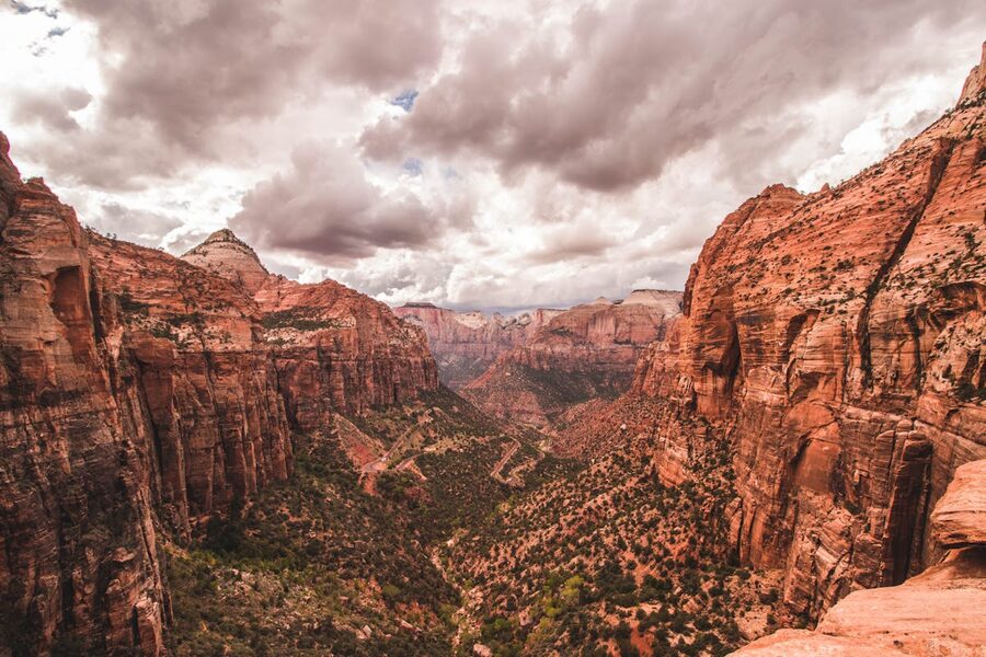 Zion Canyon red rock formations under dramatic skies Utah