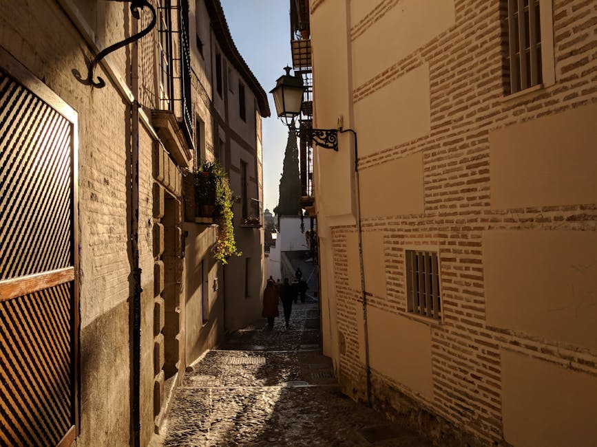 Cobblestone alleyway in Granada at dusk