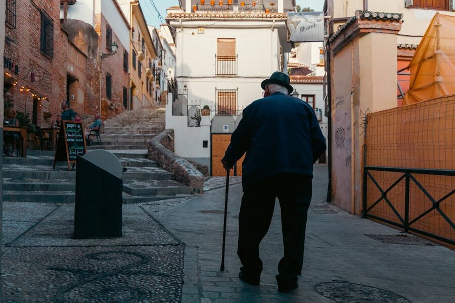 A walker on a Granada cobblestone street near the Albaicin
