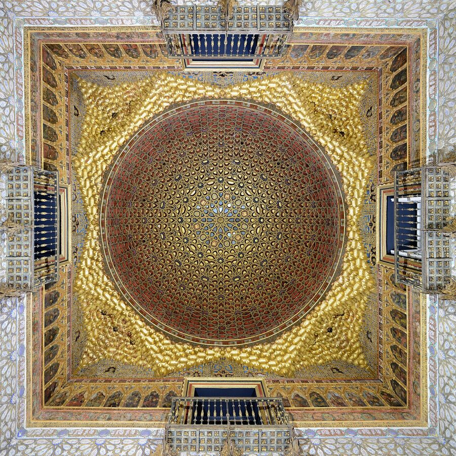 Aerial view of Real Alcazar Seville with rooftops and gardens