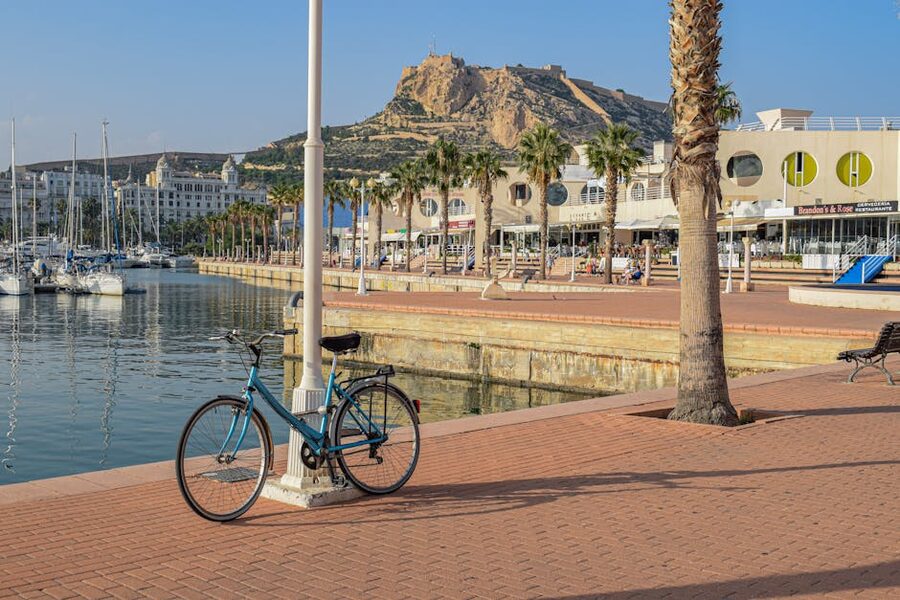 Bicycle by Alicante Marina with Santa Barbara Castle behind