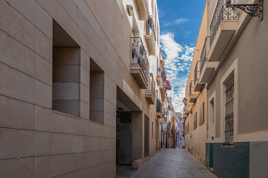Narrow street with colorful buildings in Alicante old town