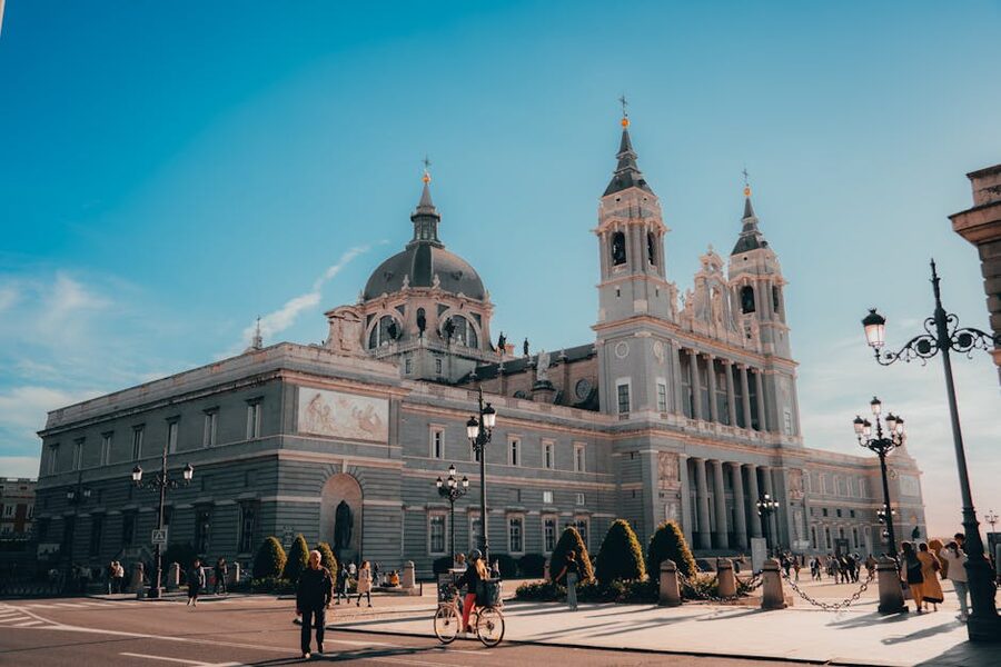 People walking in the square outside Almudena Cathedral Madrid