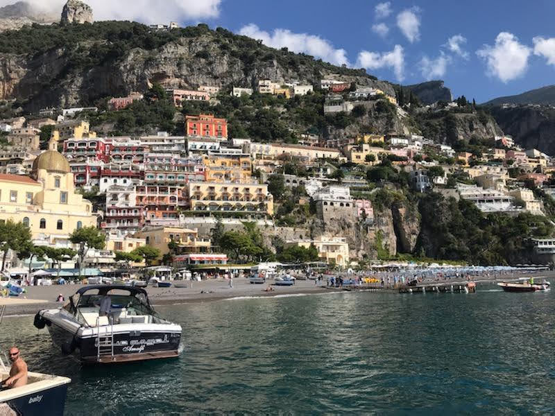 View of the Amalfi Coast cliffs from a boat on the water