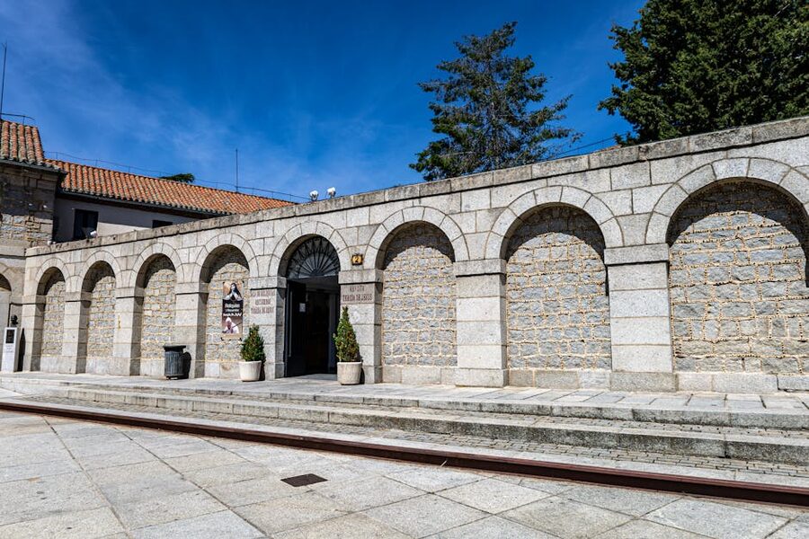Stone arches in Avila old town with traditional Spanish architecture