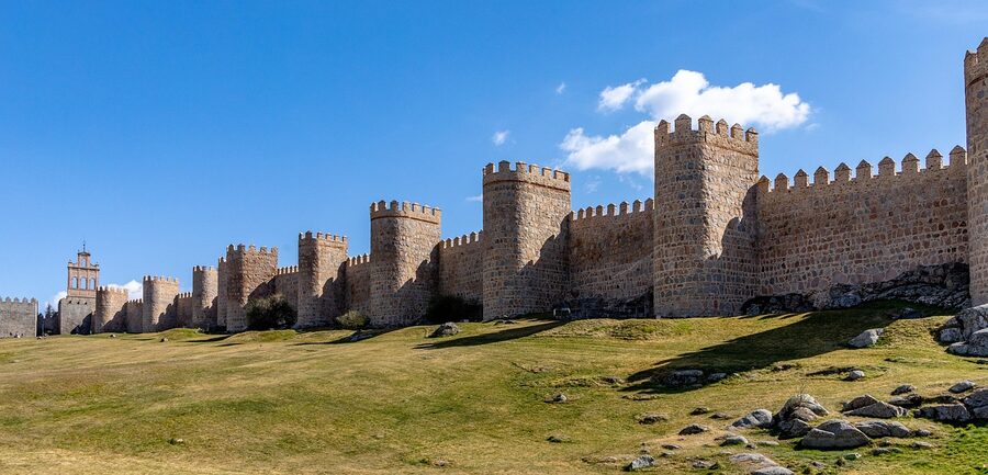 Walls of Avila set against the surrounding Castilian fields