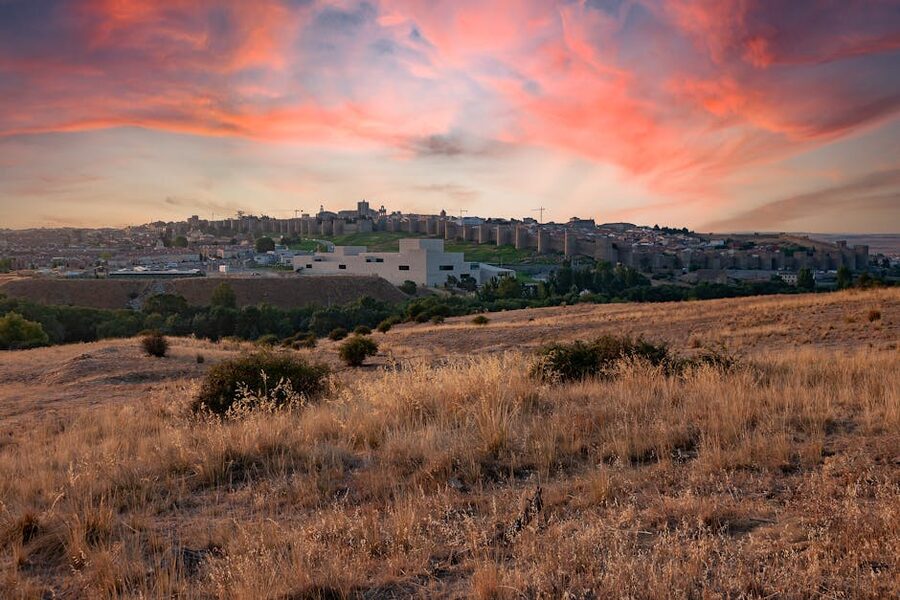 Avila walls at sunset over surrounding landscape