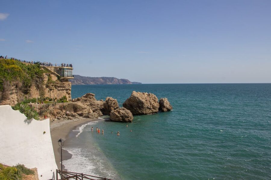 People on the Balcón de Europa observation deck above the Mediterranean in Nerja