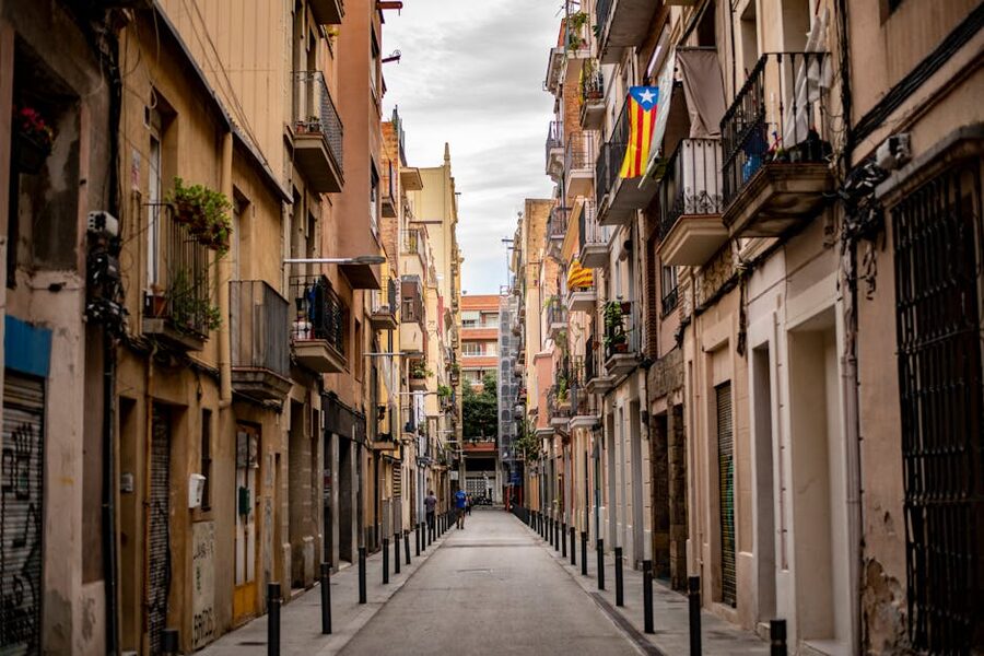 Symmetrical view down a balconied alley in Barcelona's Gothic Quarter