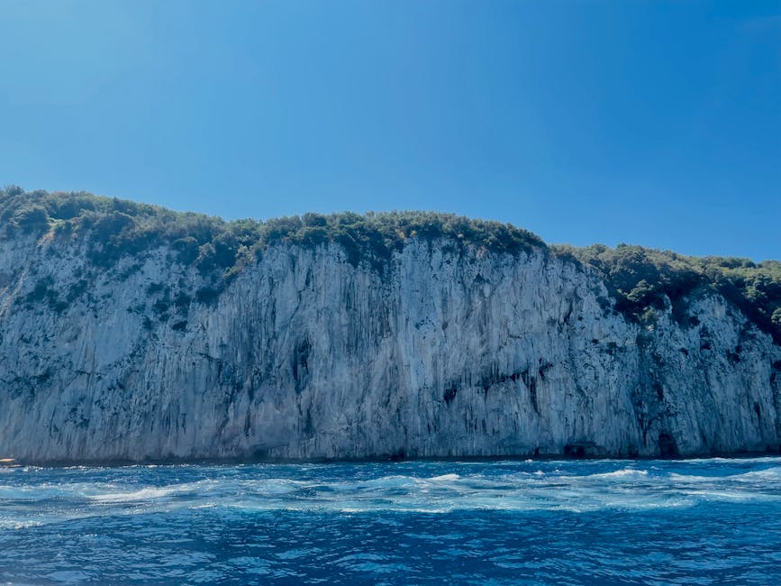 Capri cliffs and blue sea on a clear day