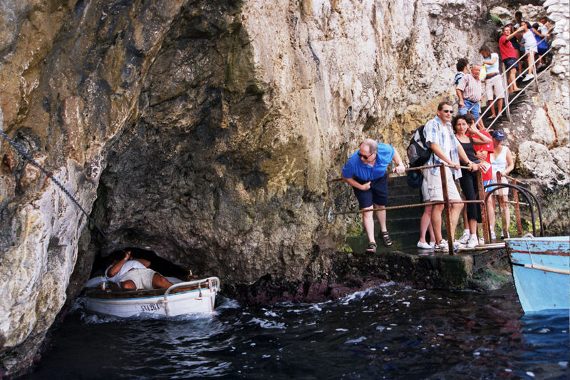 Rowboats waiting at the entrance of the Grotta Azzurra