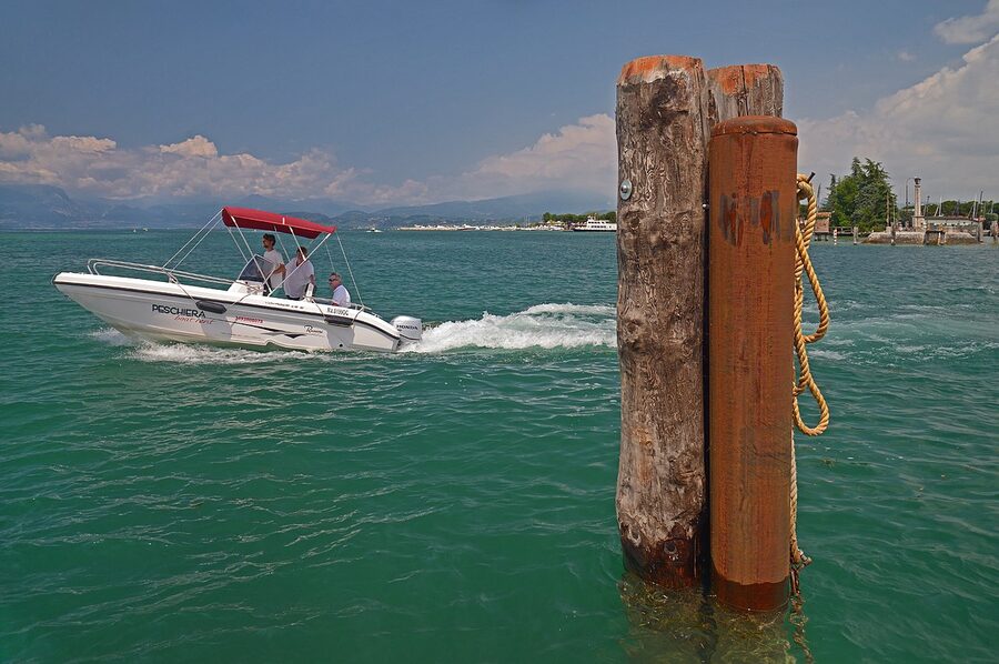 Boat jetty on Lake Garda with mountains
