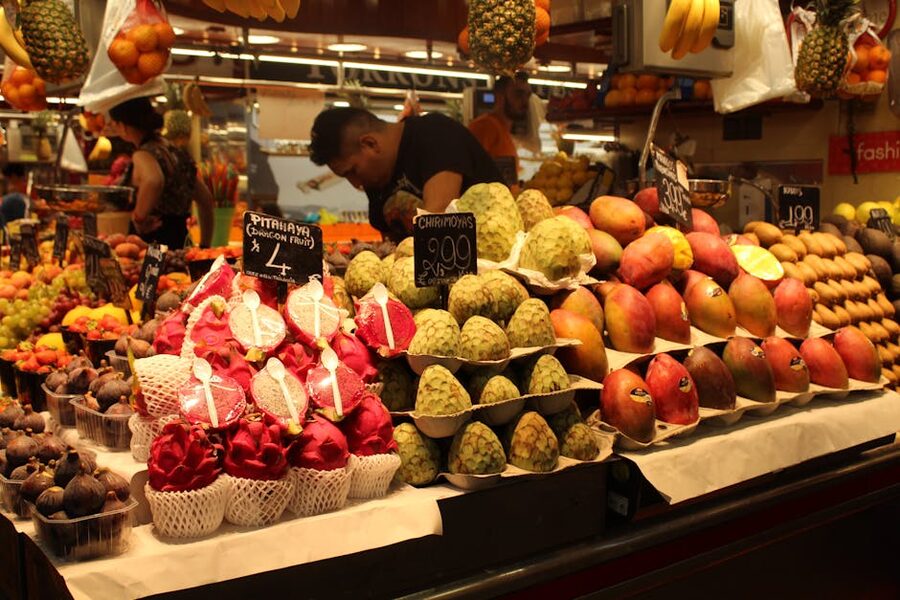 Tropical fruit display dragon fruit cherimoya at La Boqueria