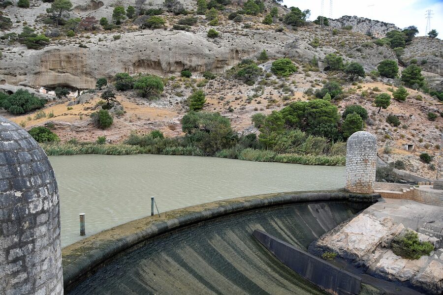 The Caminito del Rey wooden walkway in 2025 with hikers in helmets