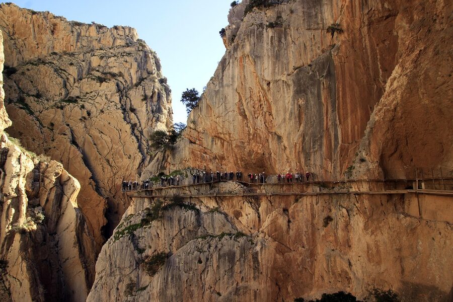 A group of tourists on the King's Path above the ravine in the Costa del Sol
