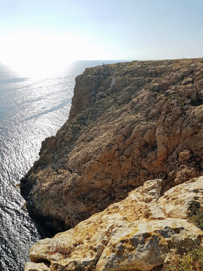 Cap de Barbaria cliff dropping into the ocean Formentera