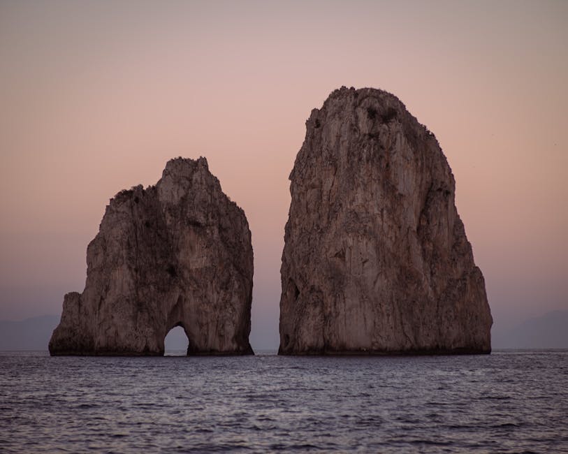 Faraglioni rocks off the coast of Capri at sunset